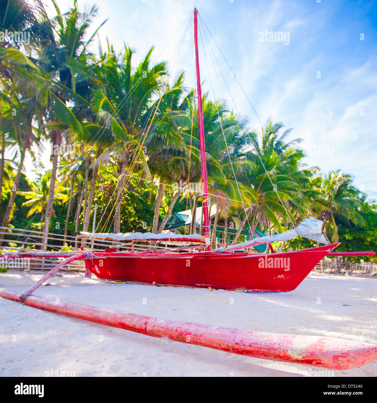 Filipino red boat on the white sand beach in Boracay island ...