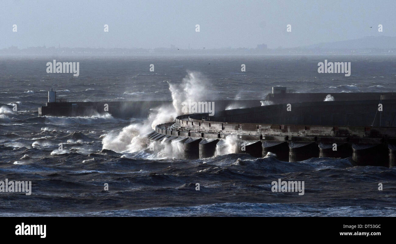Huge waves crash over Brighton Marina this afternoon as storms continue ...