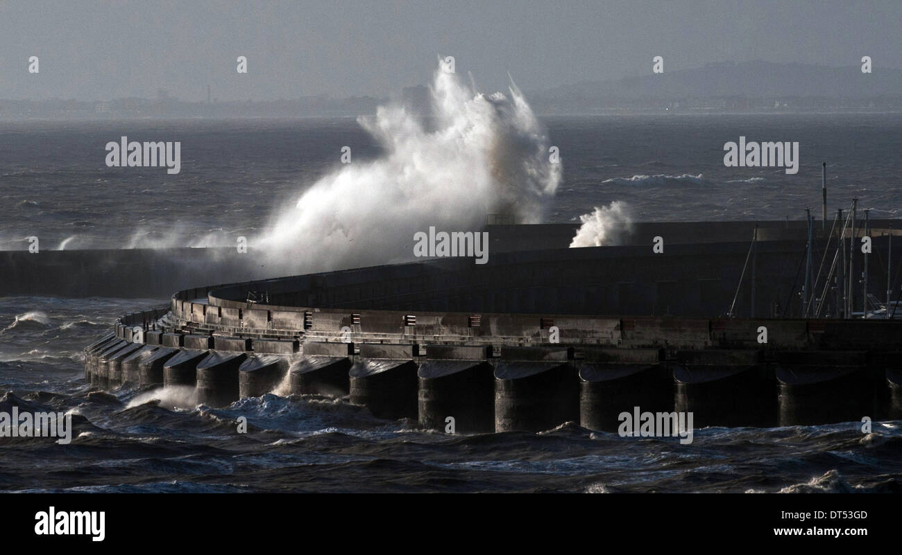 Huge waves crash over Brighton Marina this afternoon as storms continue ...