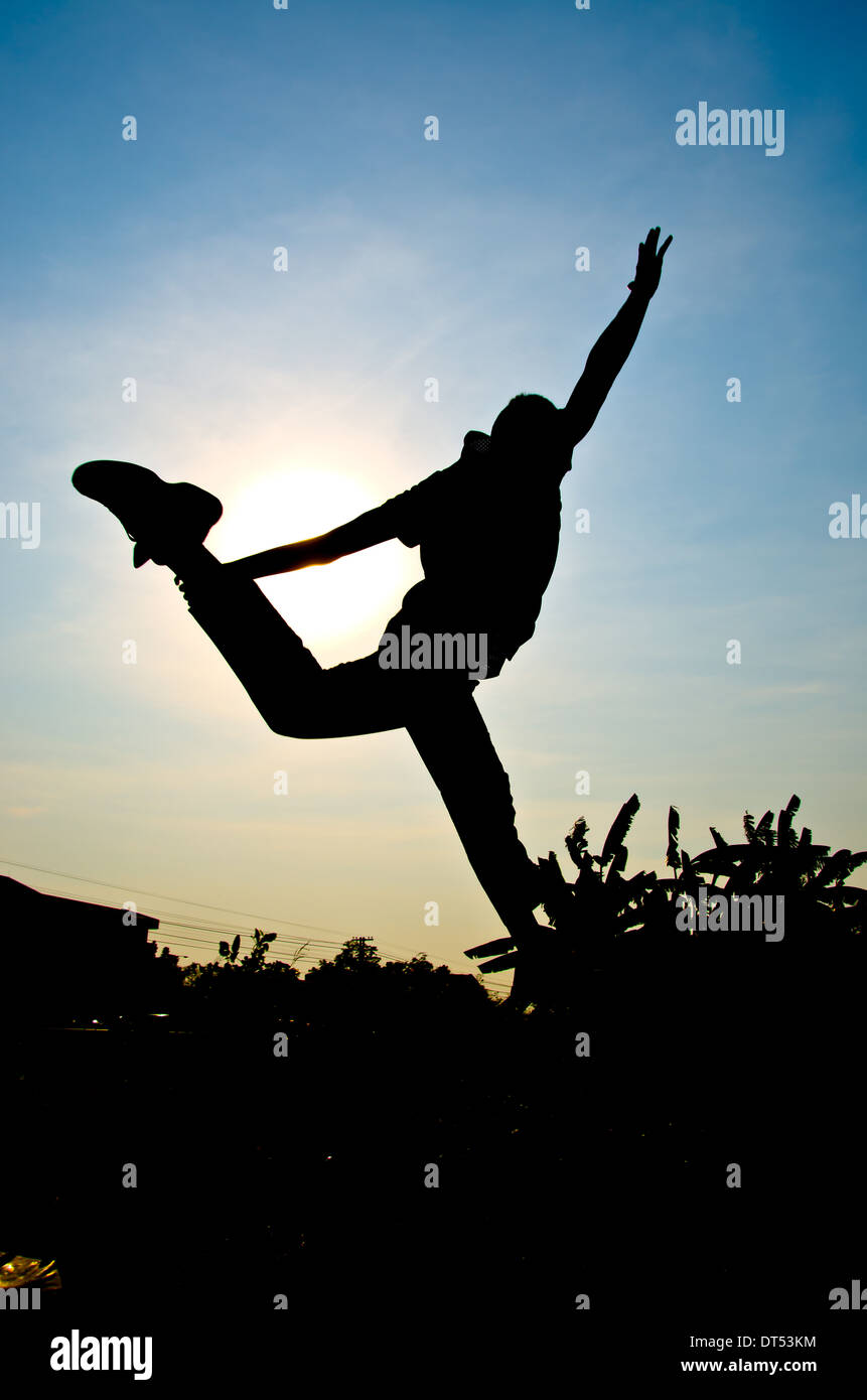 silhouette of man jumping for happy and victory Stock Photo - Alamy