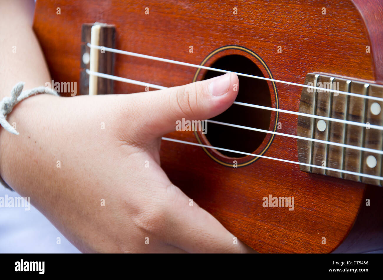 hand from children for play Ukulele Stock Photo - Alamy