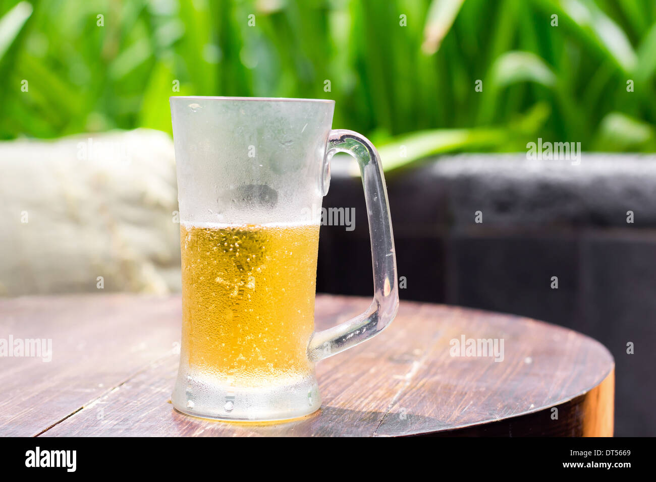 Glass of beer on table Stock Photo - Alamy