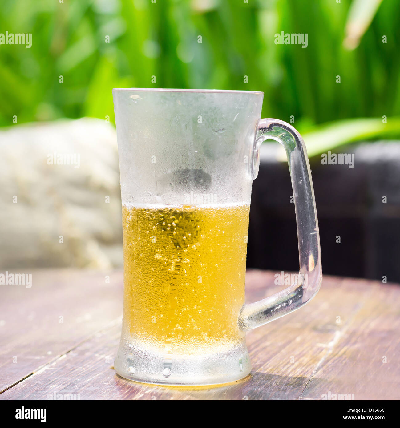 Glass of beer on table Stock Photo - Alamy