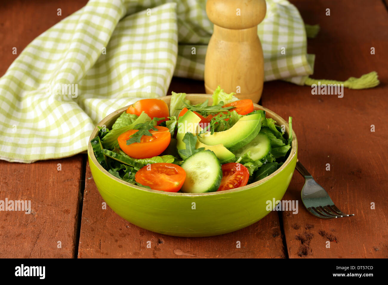 vegetable salad with avocado and tomatoes in rustic style Stock Photo ...