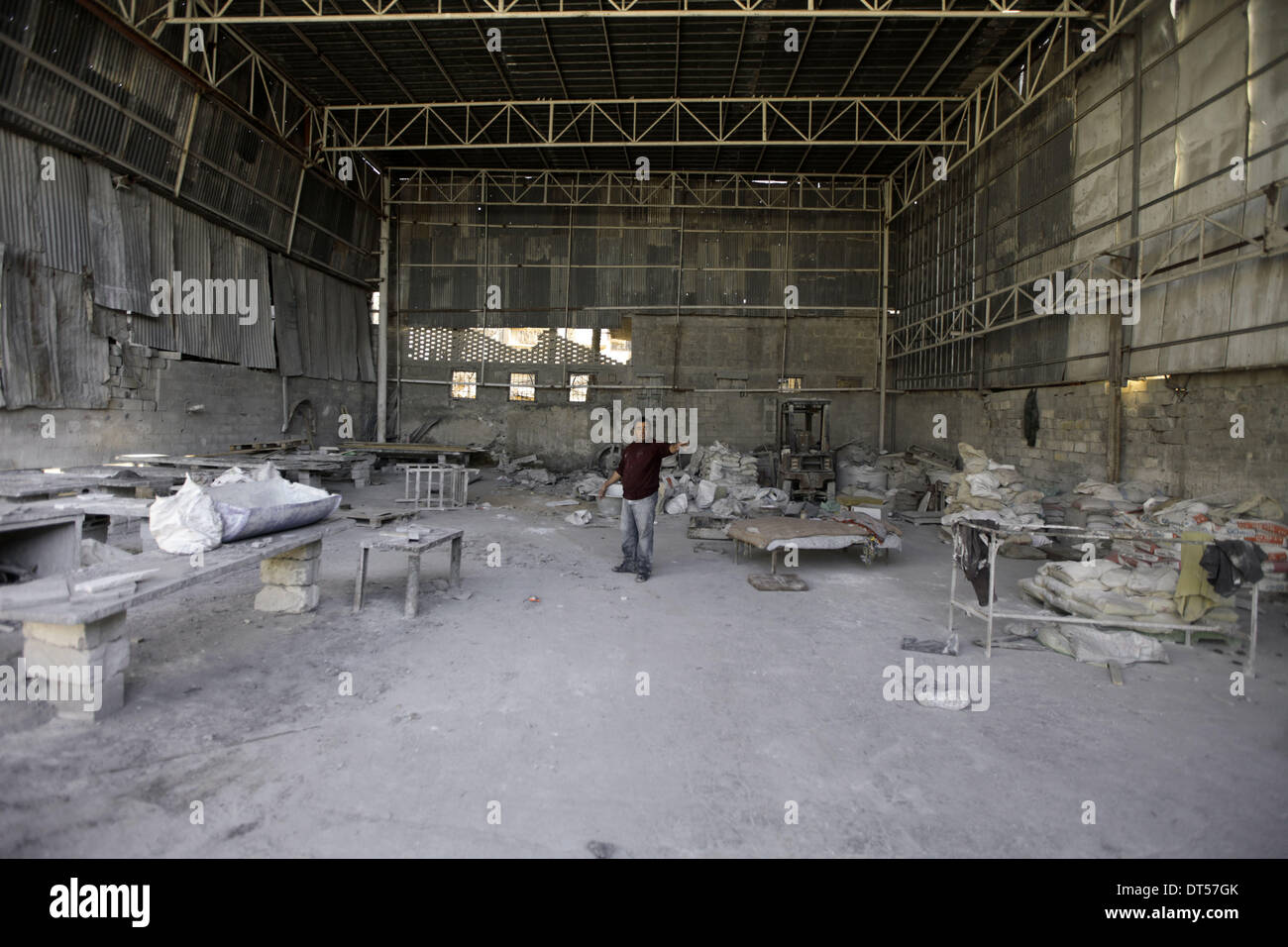 Gaza City. 9th Feb, 2014. A Palestinian worker is seen inside a ...