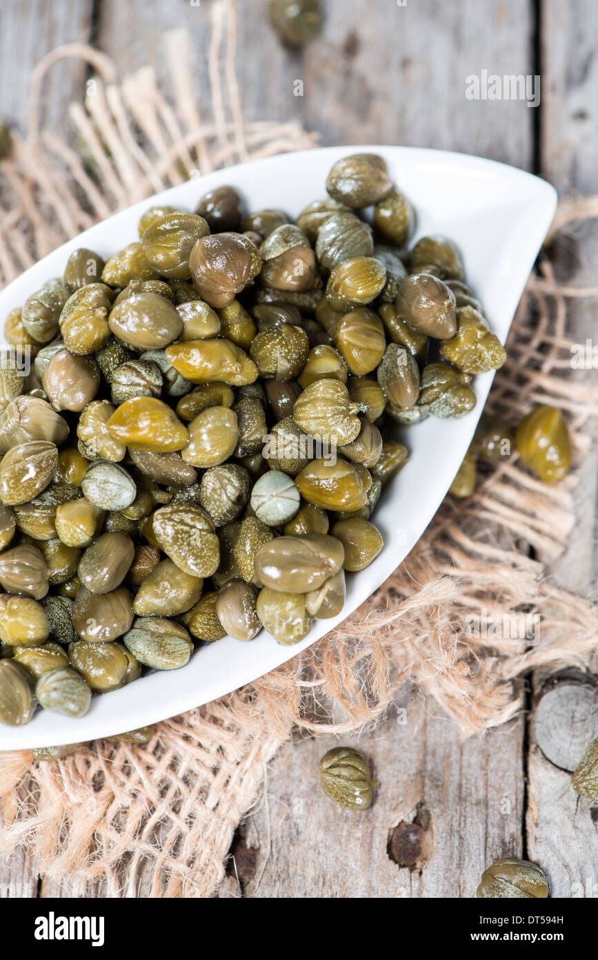 Heap of preserved Capres on vintage background Stock Photo - Alamy