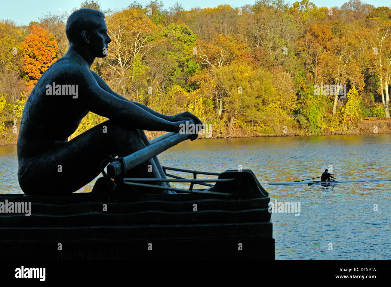 Single sculler passes the statue of John B. Kelly on Kelly Drive in ...