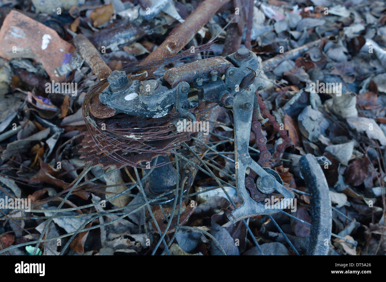 Burnt charred remains of a rusty steel and aluminum bicycle frame with ...