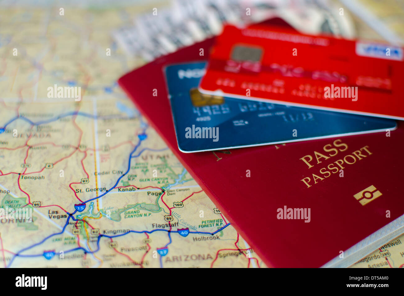 Red Passport And Credit Cards On Map Of United States. Dollar bills are ...