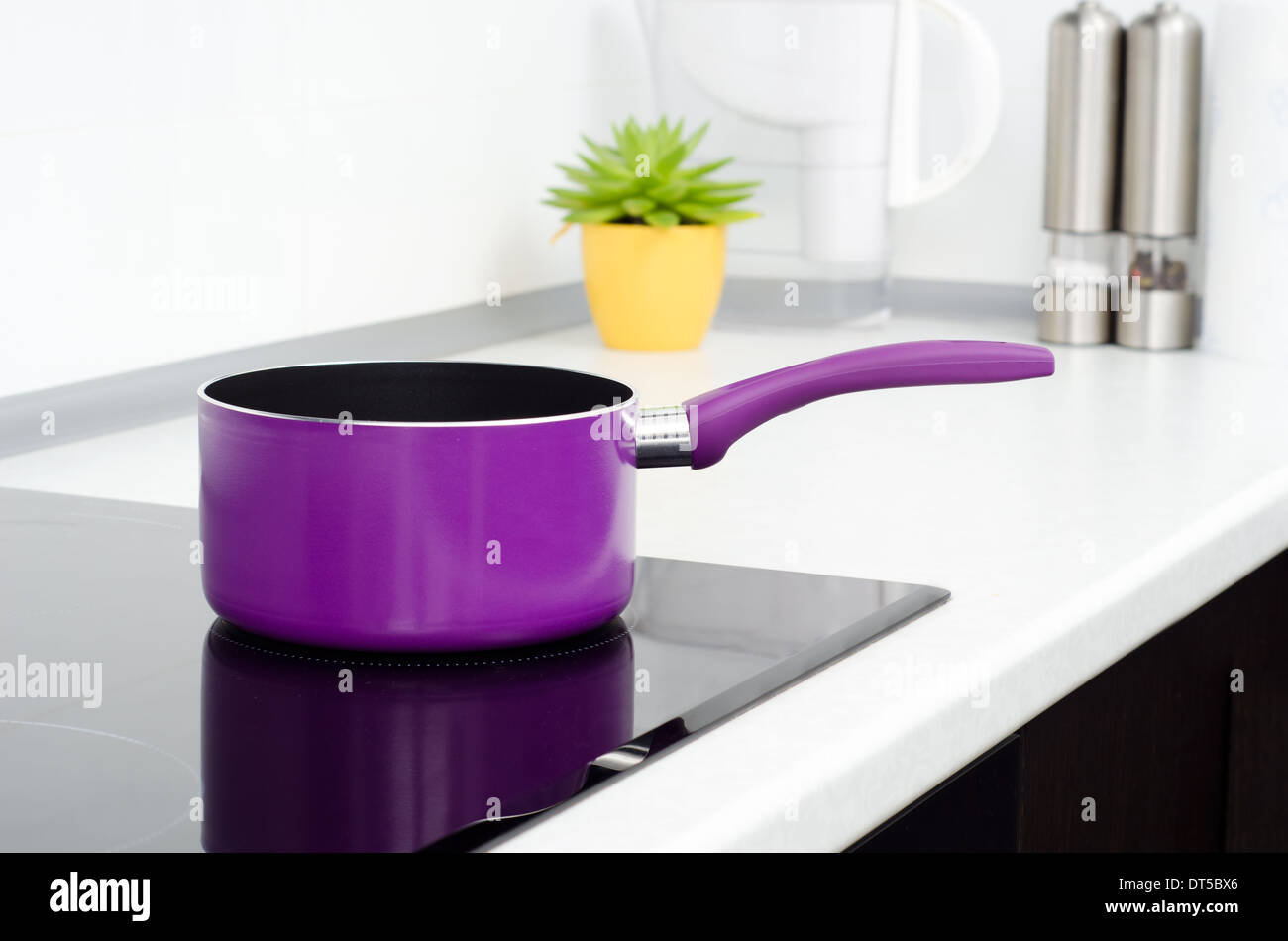 Pan in modern kitchen with induction stove Stock Photo - Alamy