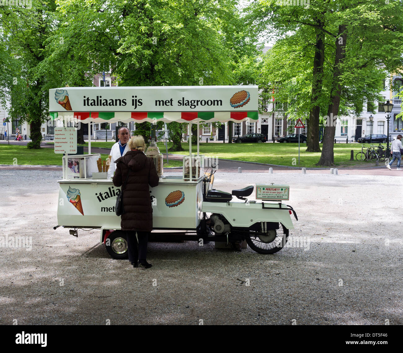 Dutch lady buying ice cream from a man in Lange Voorhout a Dutch public ...