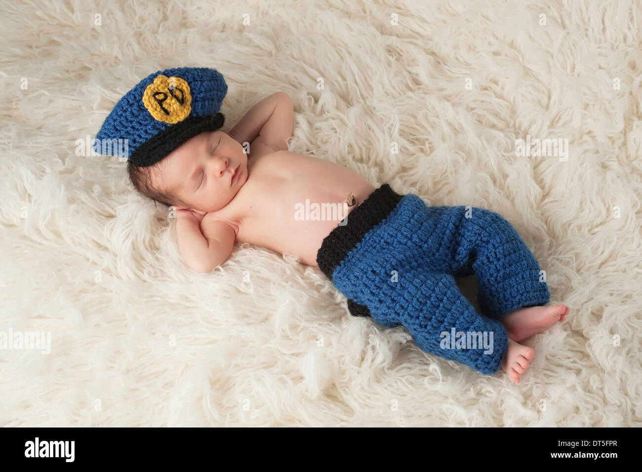 Newborn Baby Boy Wearing a Police Uniform Stock Photo - Alamy