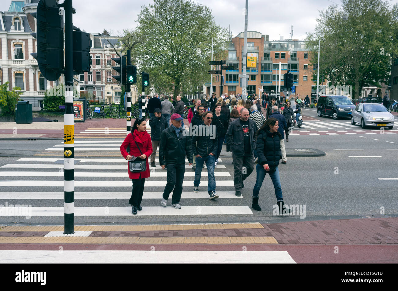 Dutch people men and women crossing a road at a zebra crossing ...