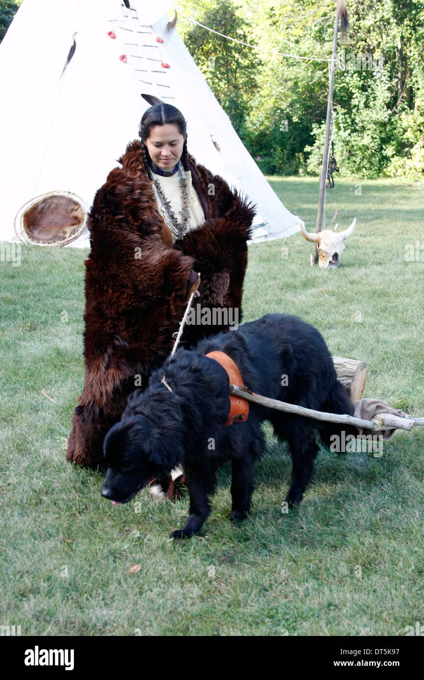 A Native American Lakota Sioux Indian woman in a buffalo robe with a ...