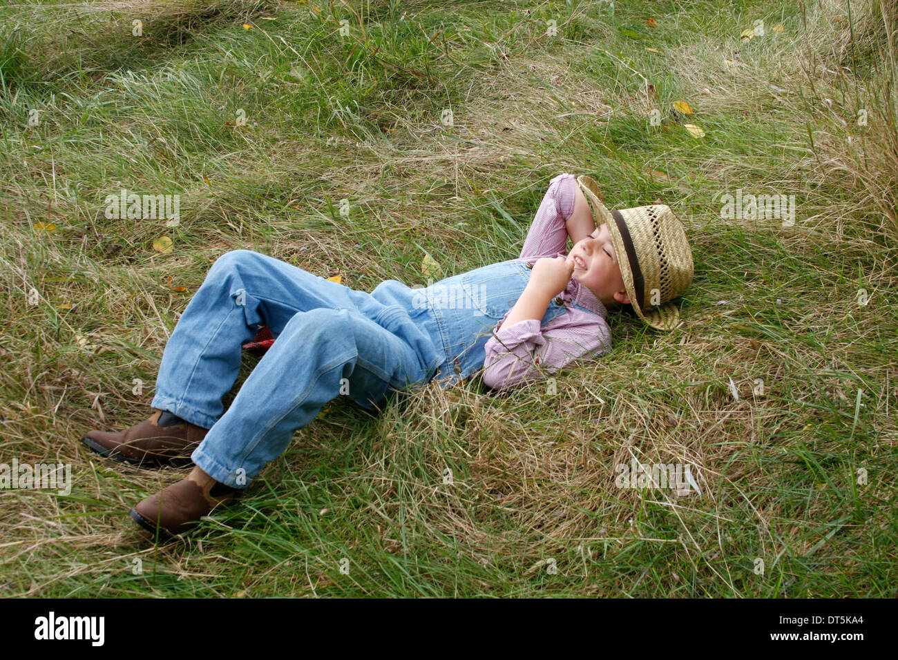 Country boy chewing on grass hi-res stock photography and images - Alamy