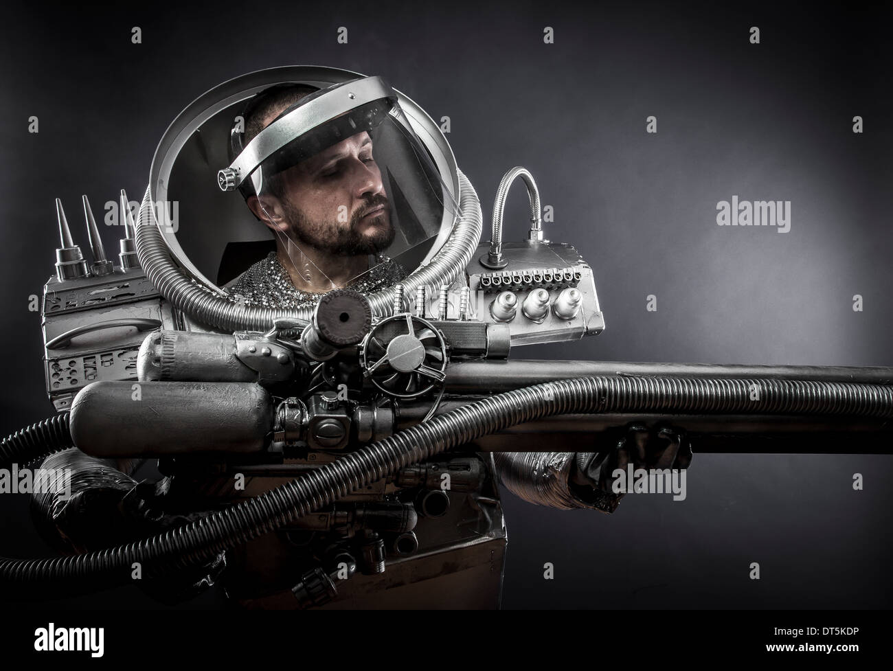 Cosmos, Astronaut on a black background with huge weapon Stock Photo ...