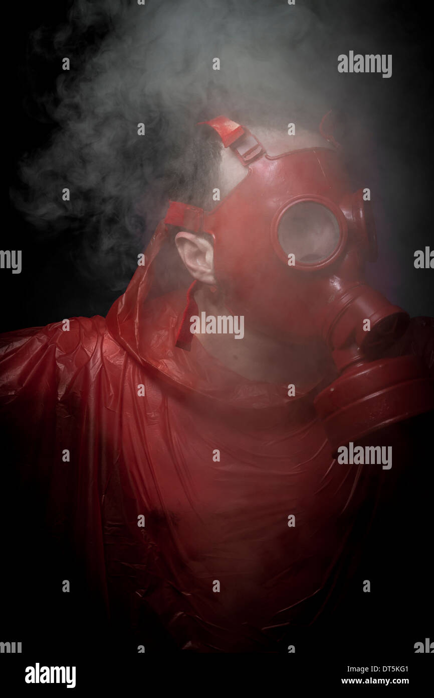 Destruction, A man in a gas mask over the smoke. black background and ...