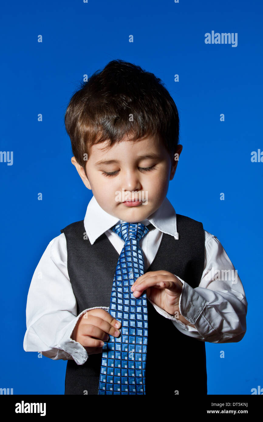 Success, cute little boy portrait over blue chroma background Stock ...