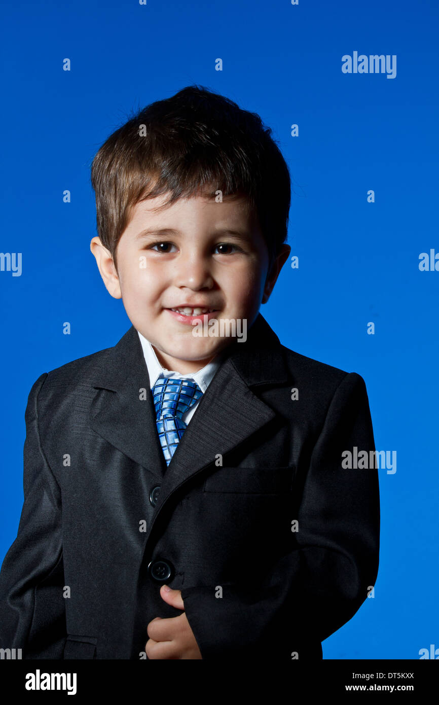 Cute little boy portrait over blue chroma background Stock Photo - Alamy