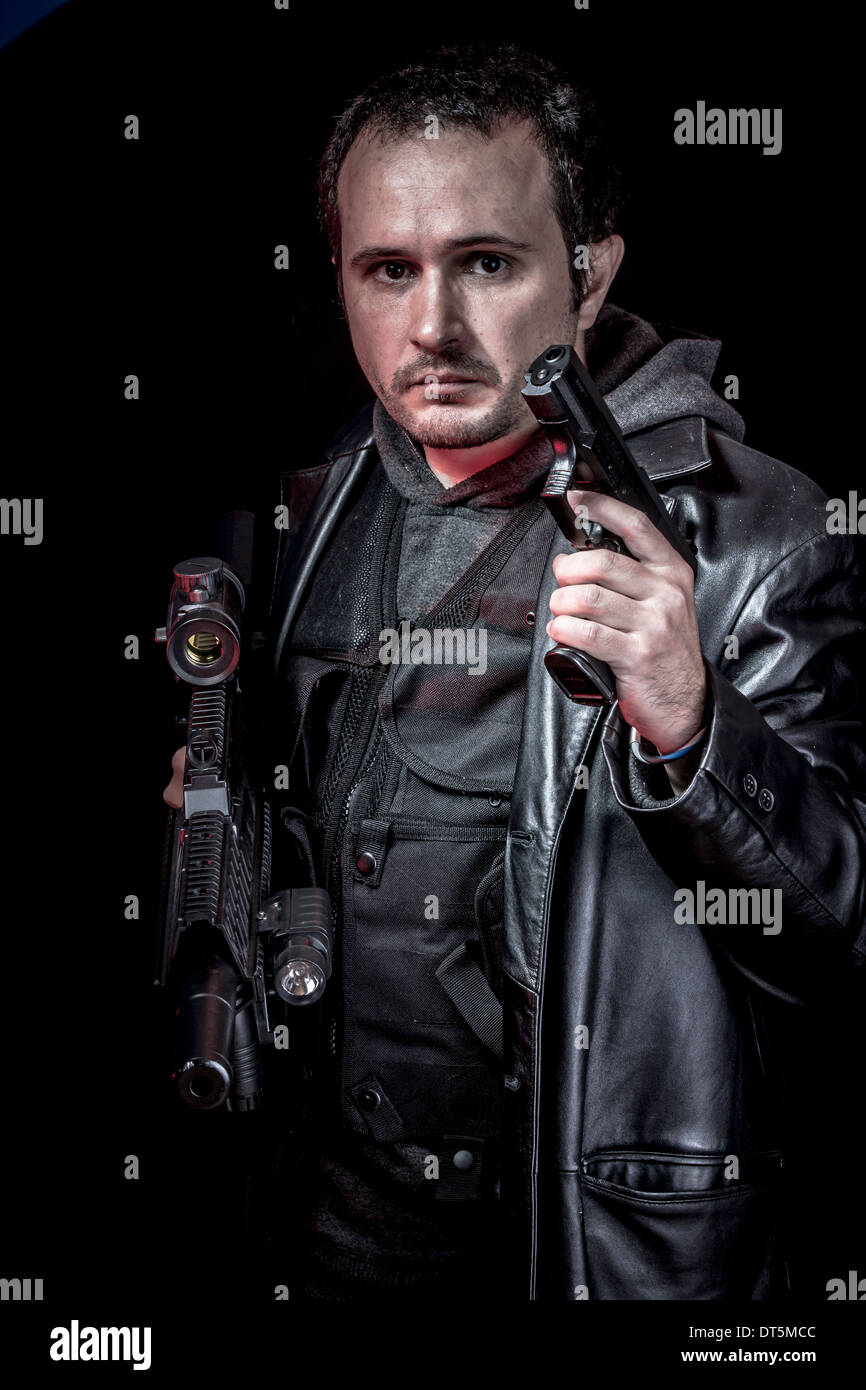Mafia, thief, armed man with black leather jacket, dangerous Stock ...