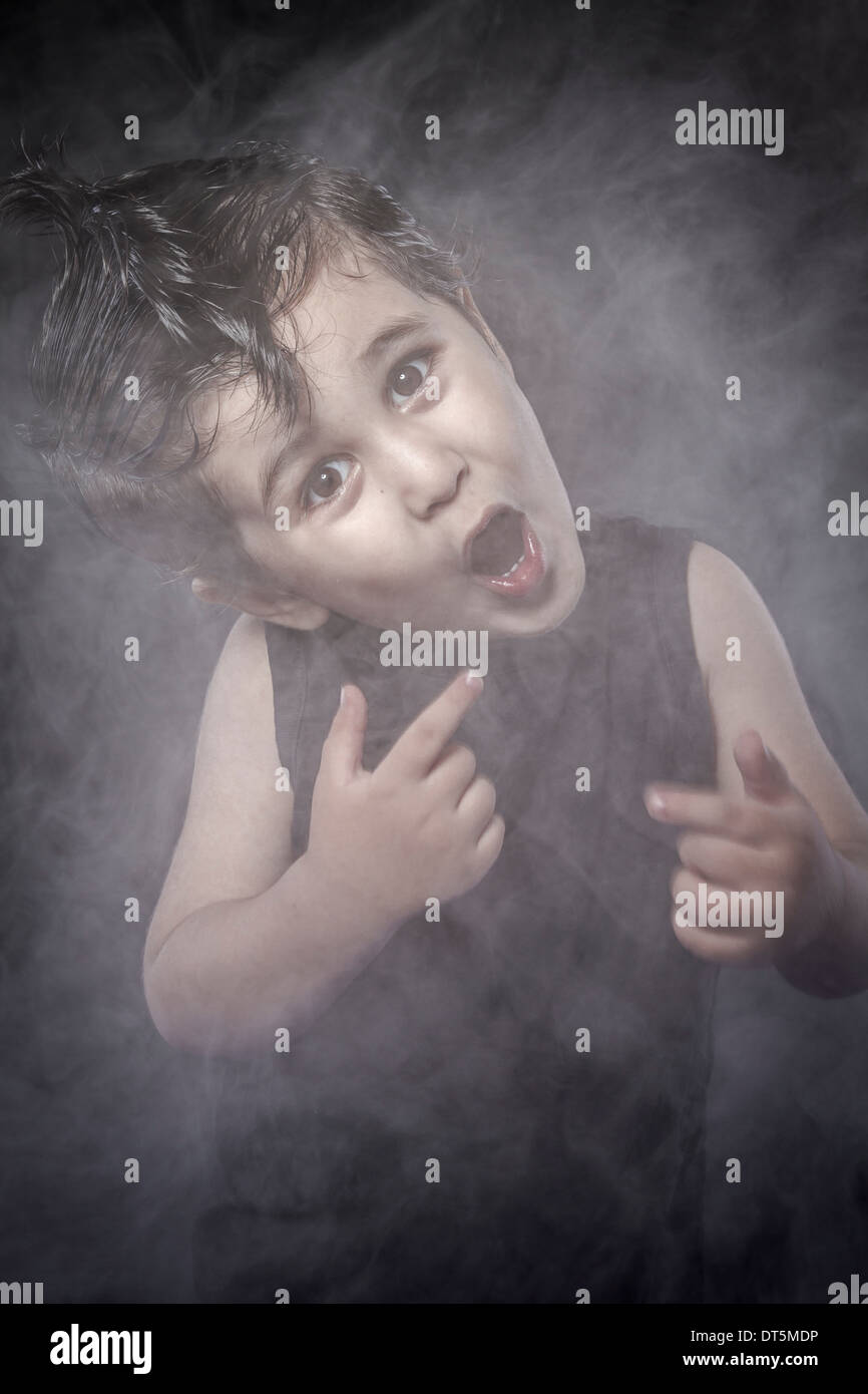 Rock, child rocker dress and funny expressions crested Stock Photo - Alamy