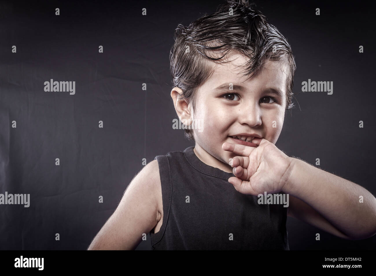 Rock, child rocker dress and funny expressions crested Stock Photo - Alamy