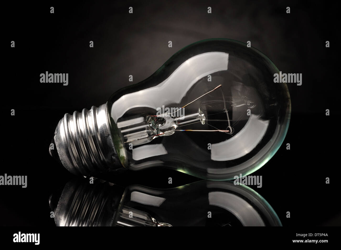 Light bulb on black background Stock Photo - Alamy