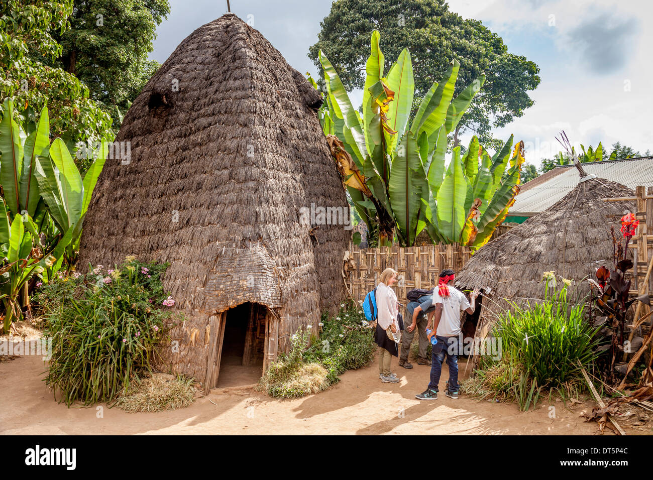 Tourists Visiting A Traditional Dorze House, Hayzo Village, Arba Minch ...