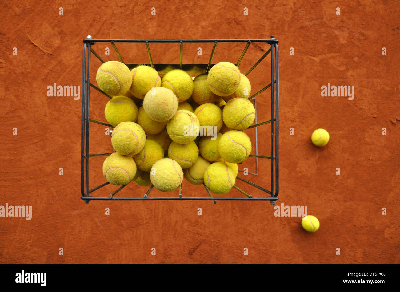 Many tennis balls on court Stock Photo - Alamy
