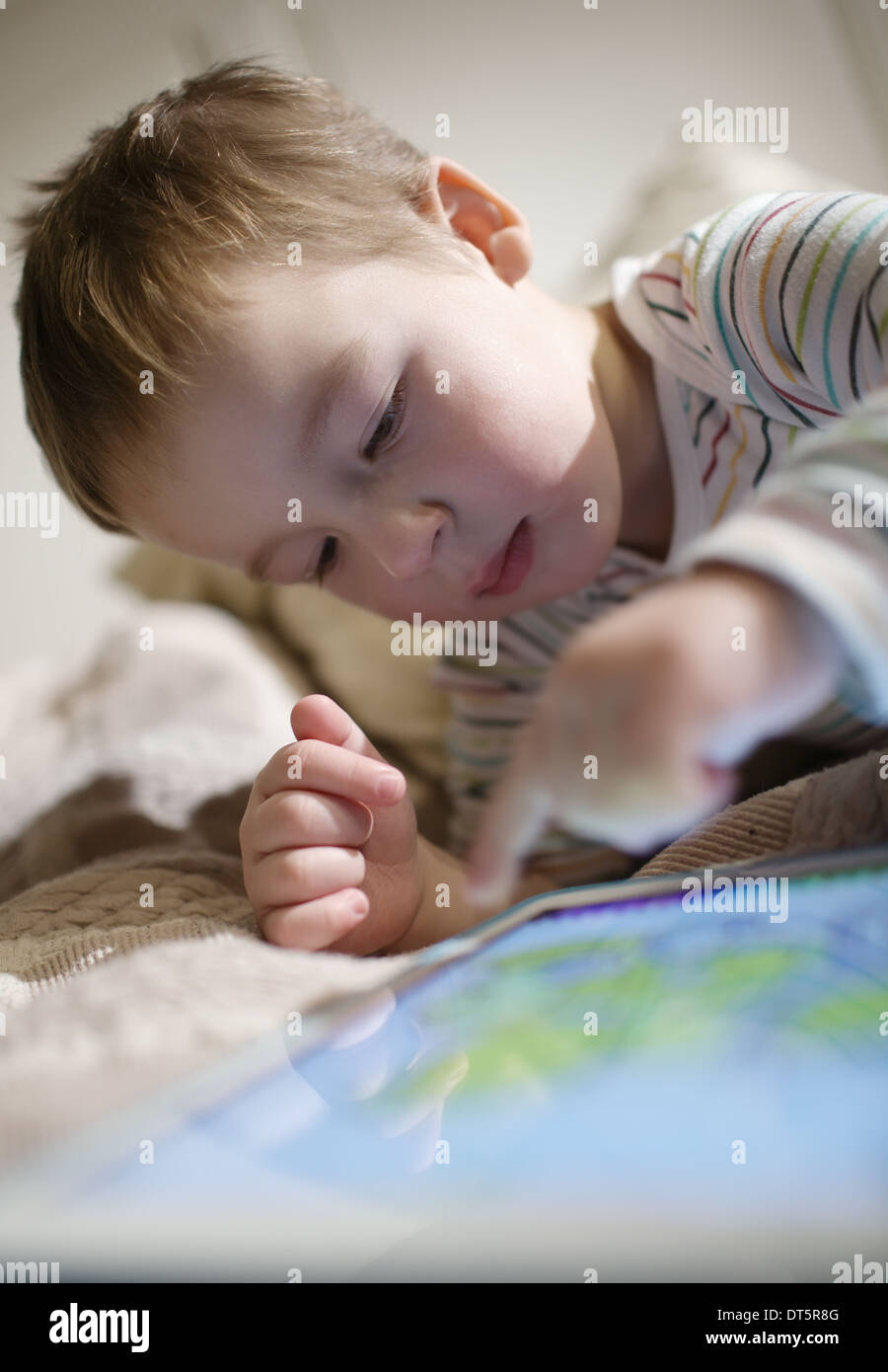 Boy using touchpad Stock Photo - Alamy