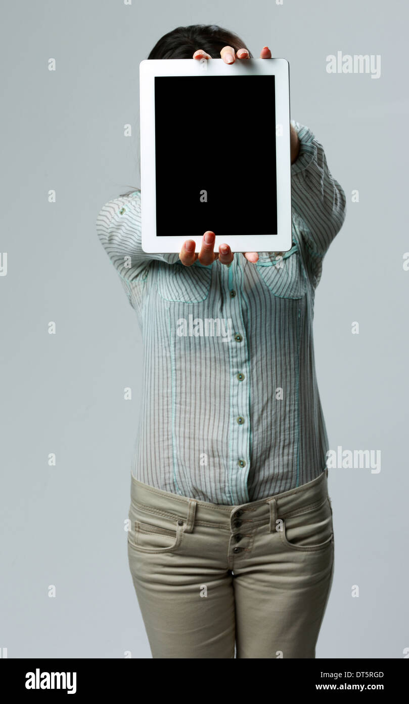 Woman showing tablet screen hi-res stock photography and images - Alamy