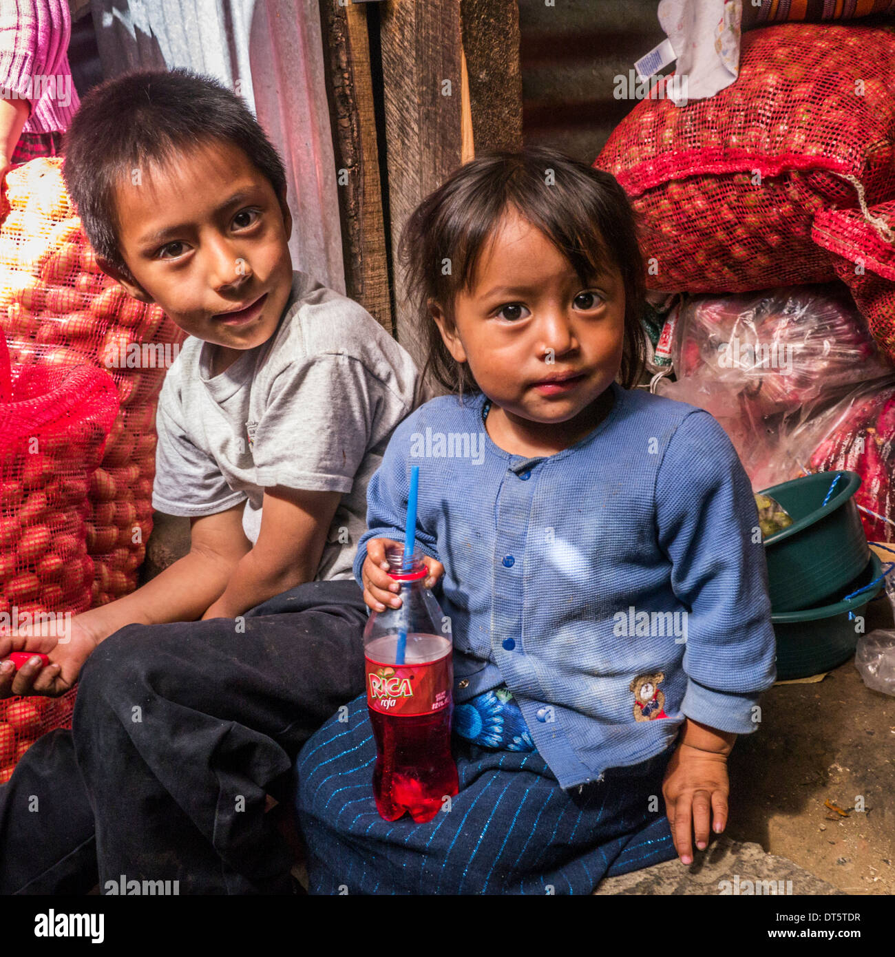 Market trader's children at Antigua central market, Guatemala Stock ...