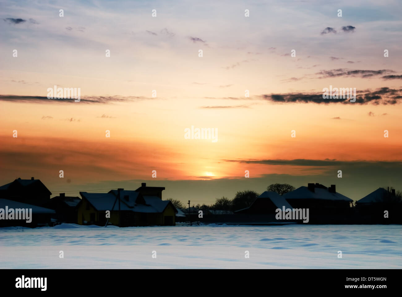 Rural winter landscape with sundown and houses under the snow Stock ...