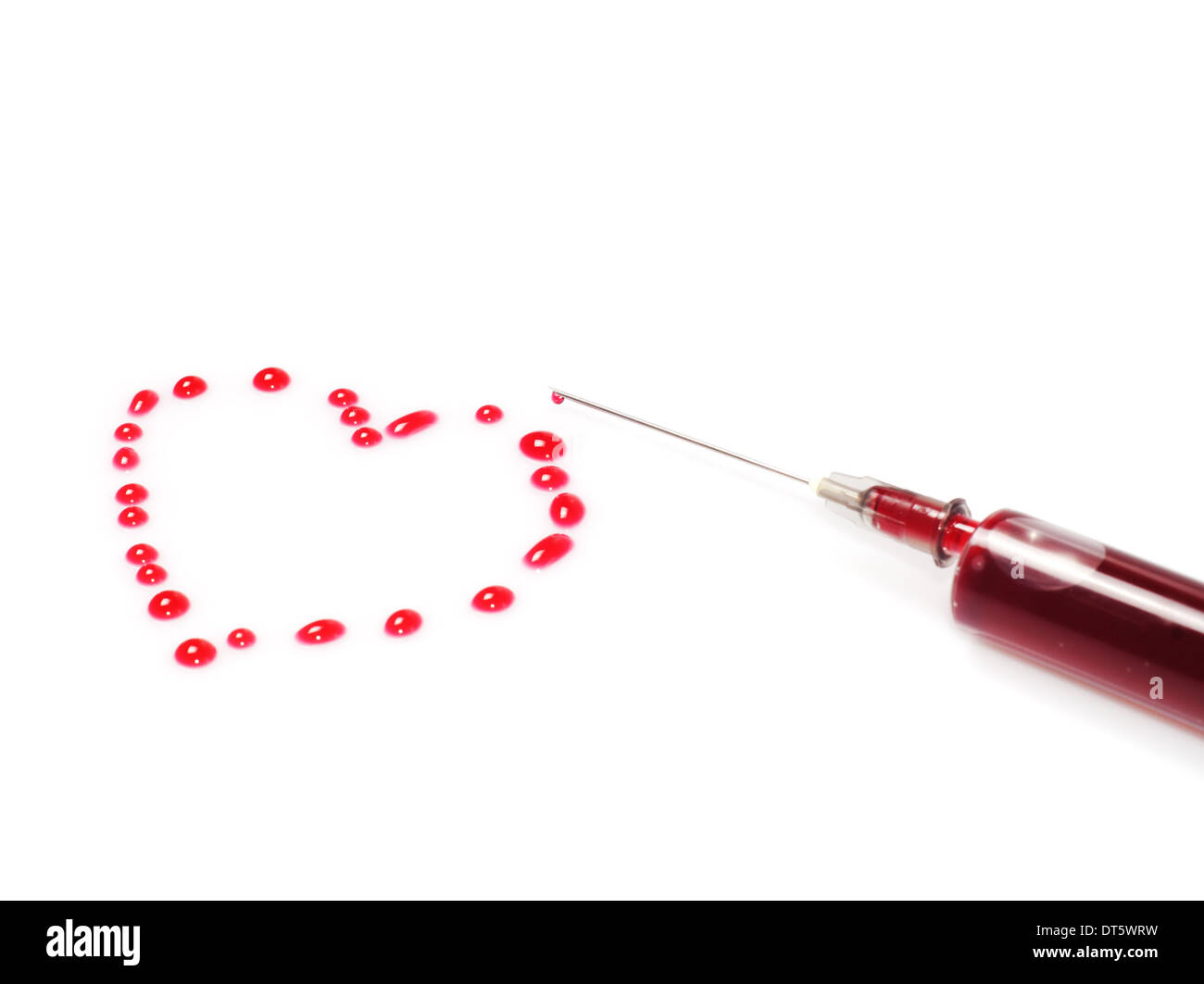 Heart shape from drops of red liquid in syringe isolated on white ...