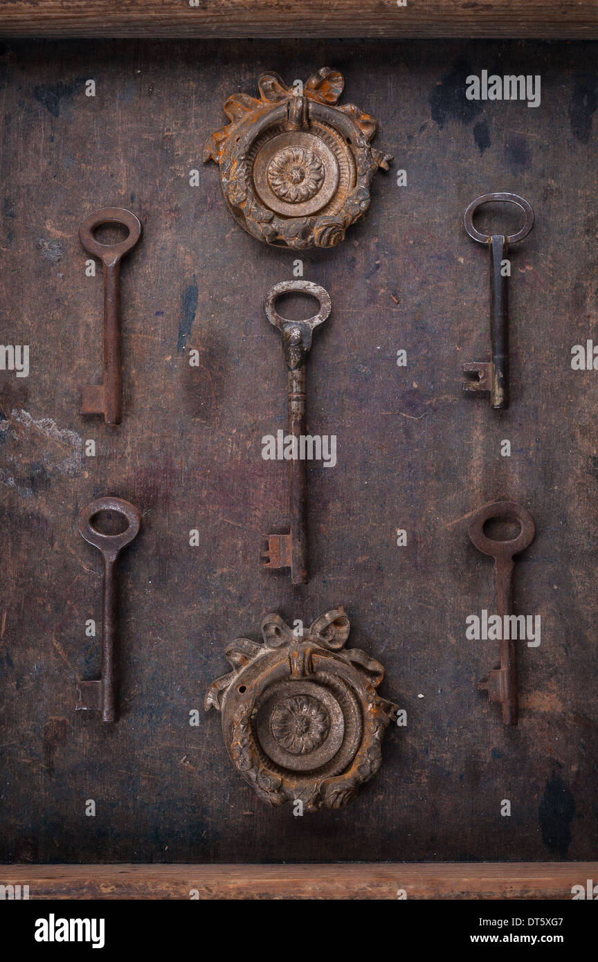Antique bronze keys wooden background hi-res stock photography and ...