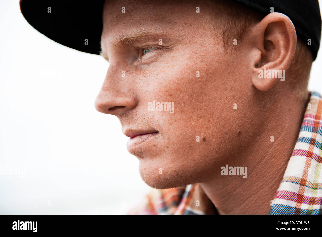 Young adult man in baseball cap hi-res stock photography and images - Alamy