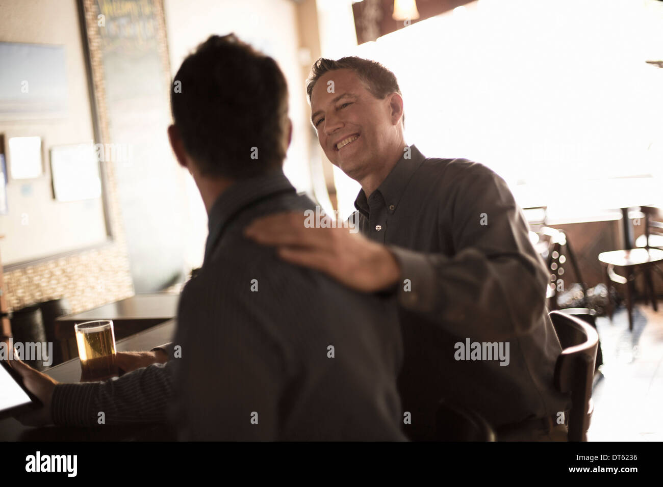 Business Man Sitting In Bar Stock Photos & Business Man Sitting In Bar ...