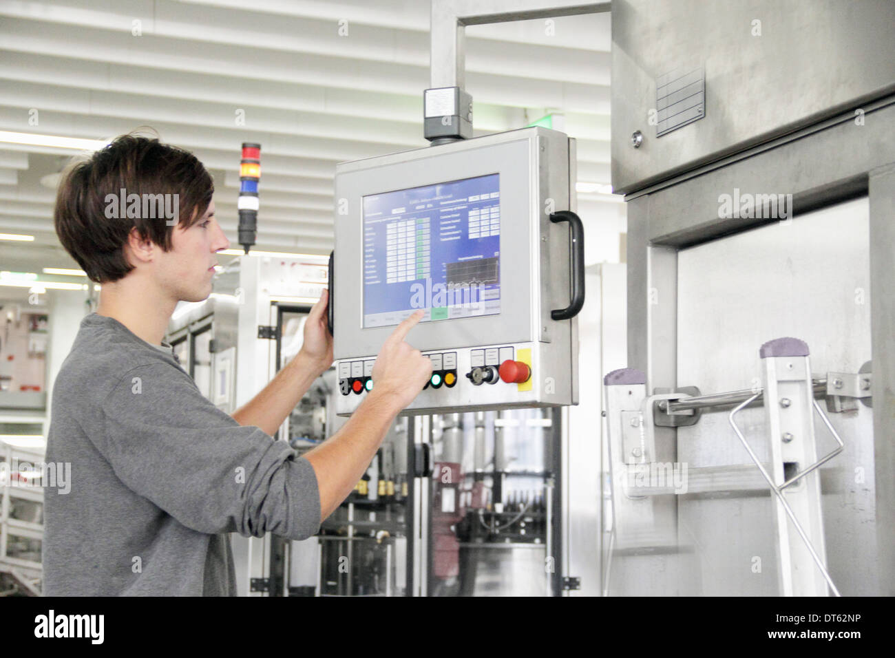 Man using control panel in brewery Stock Photo - Alamy