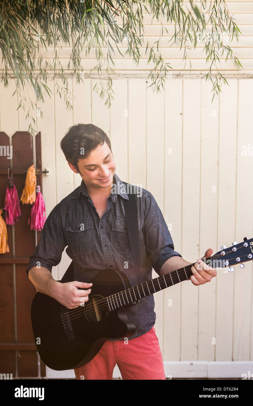 Man playing on guitar outdoors hi-res stock photography and images - Alamy