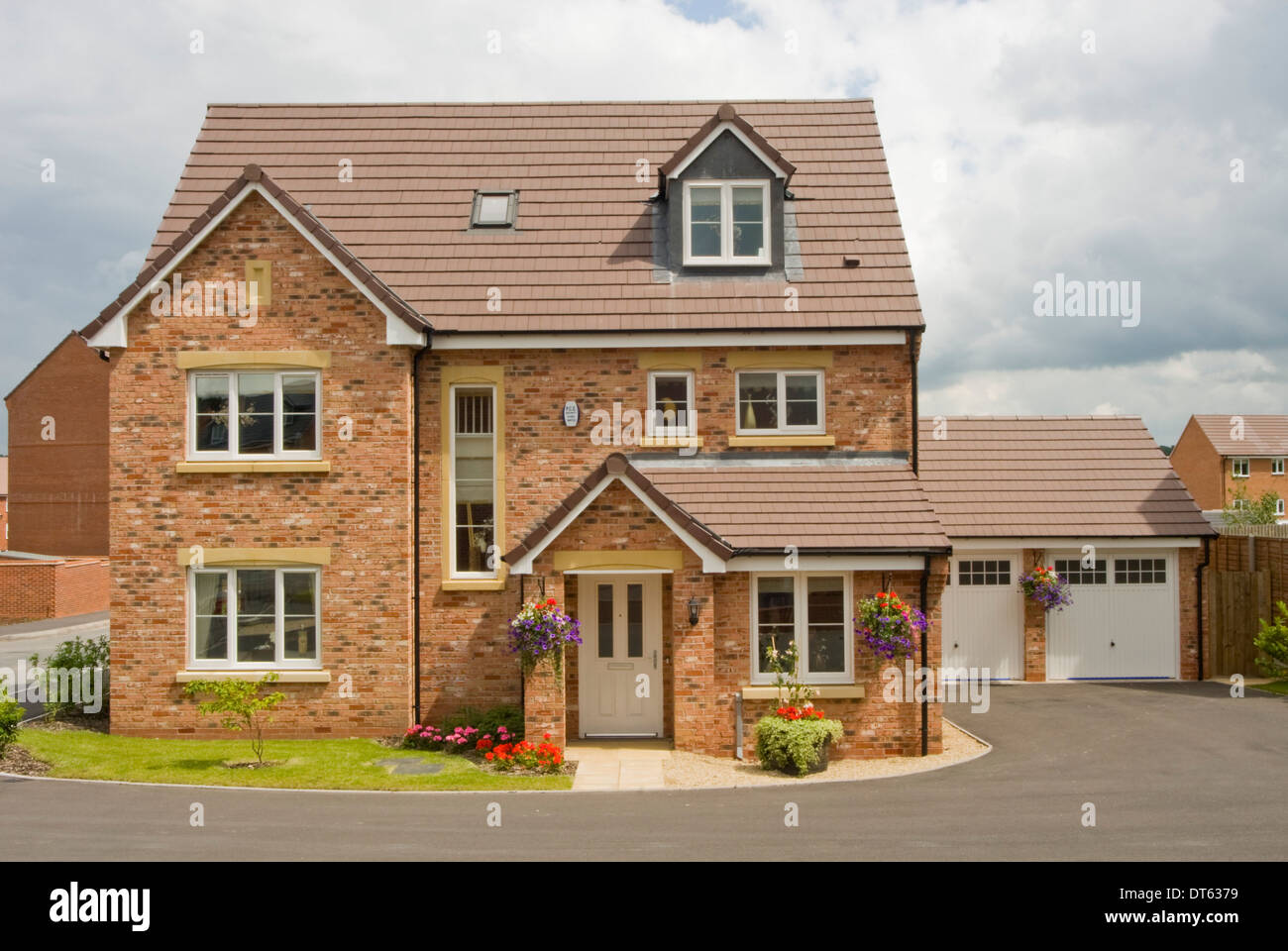 New build red brick detached house Stock Photo - Alamy