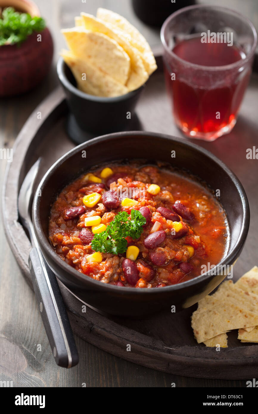mexican chili con carne in black bowl with tortilla Stock Photo - Alamy
