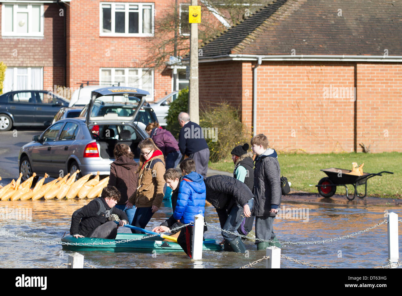 Datchet, UK. 10th Feb, 2014. Children with an inflatable dinghy in ...