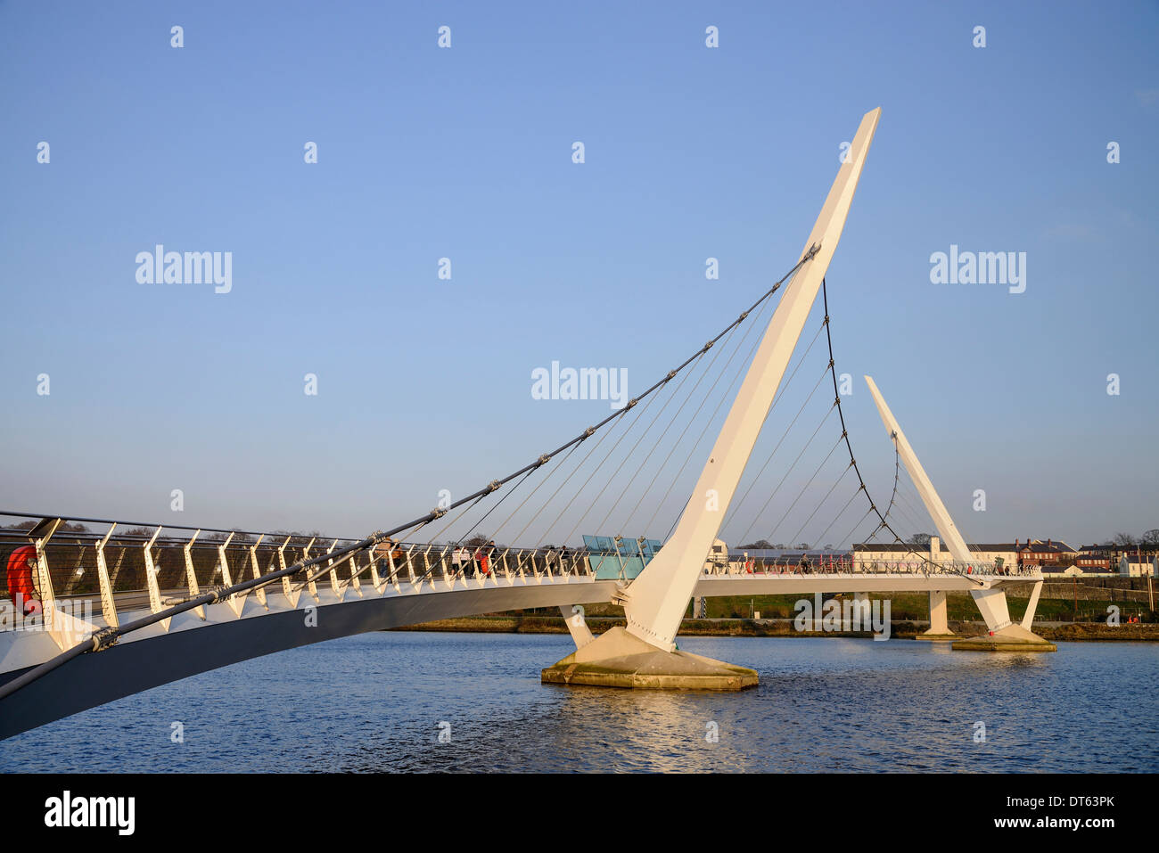 Ireland, Derry, The Peace Bridge over the River Foyle opened in 2011 ...