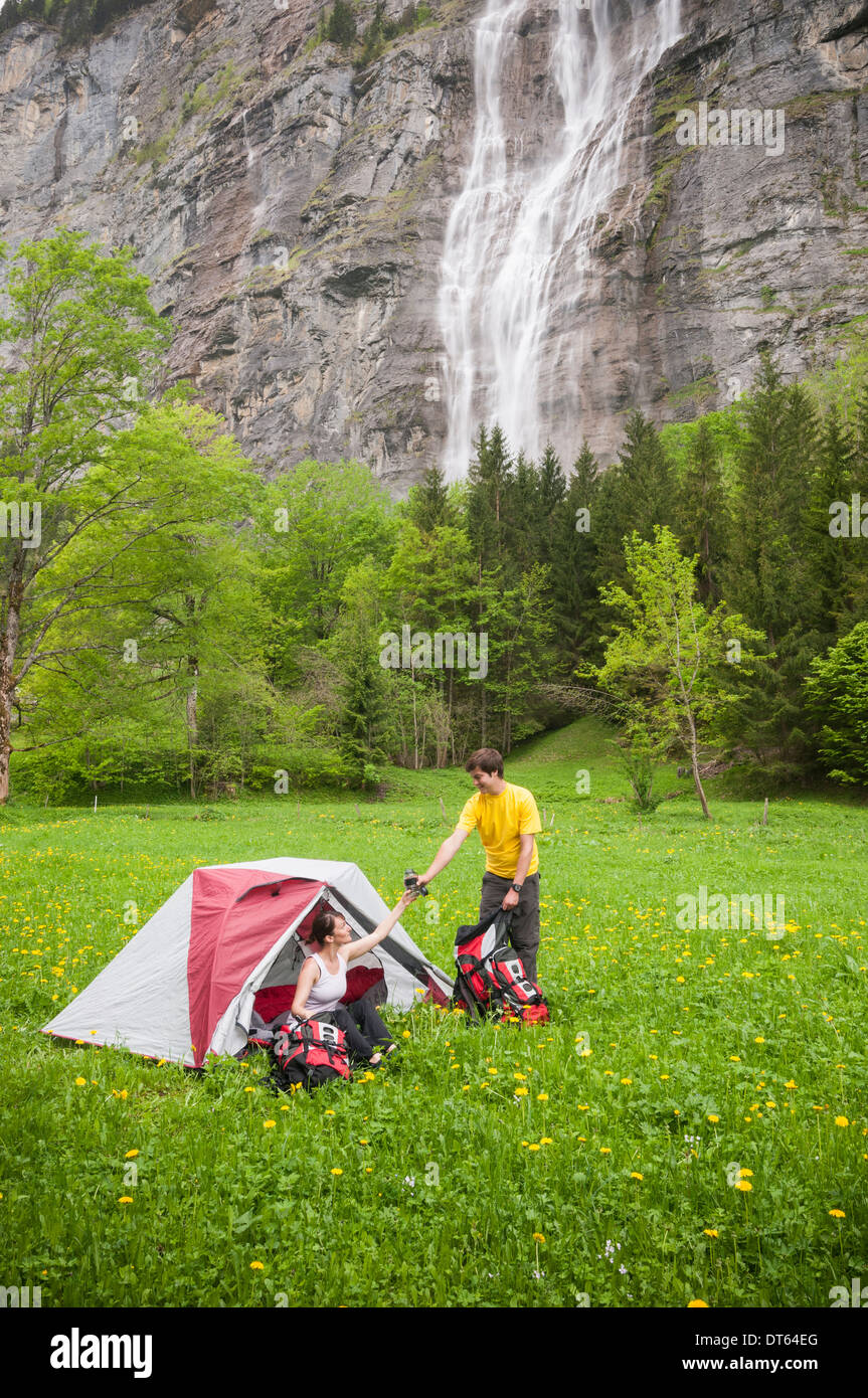 Couple camping, Stechelberg, Bernese Oberland, Switzerland Stock Photo ...
