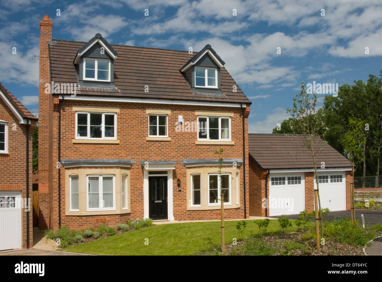 New build red brick detached house Stock Photo - Alamy