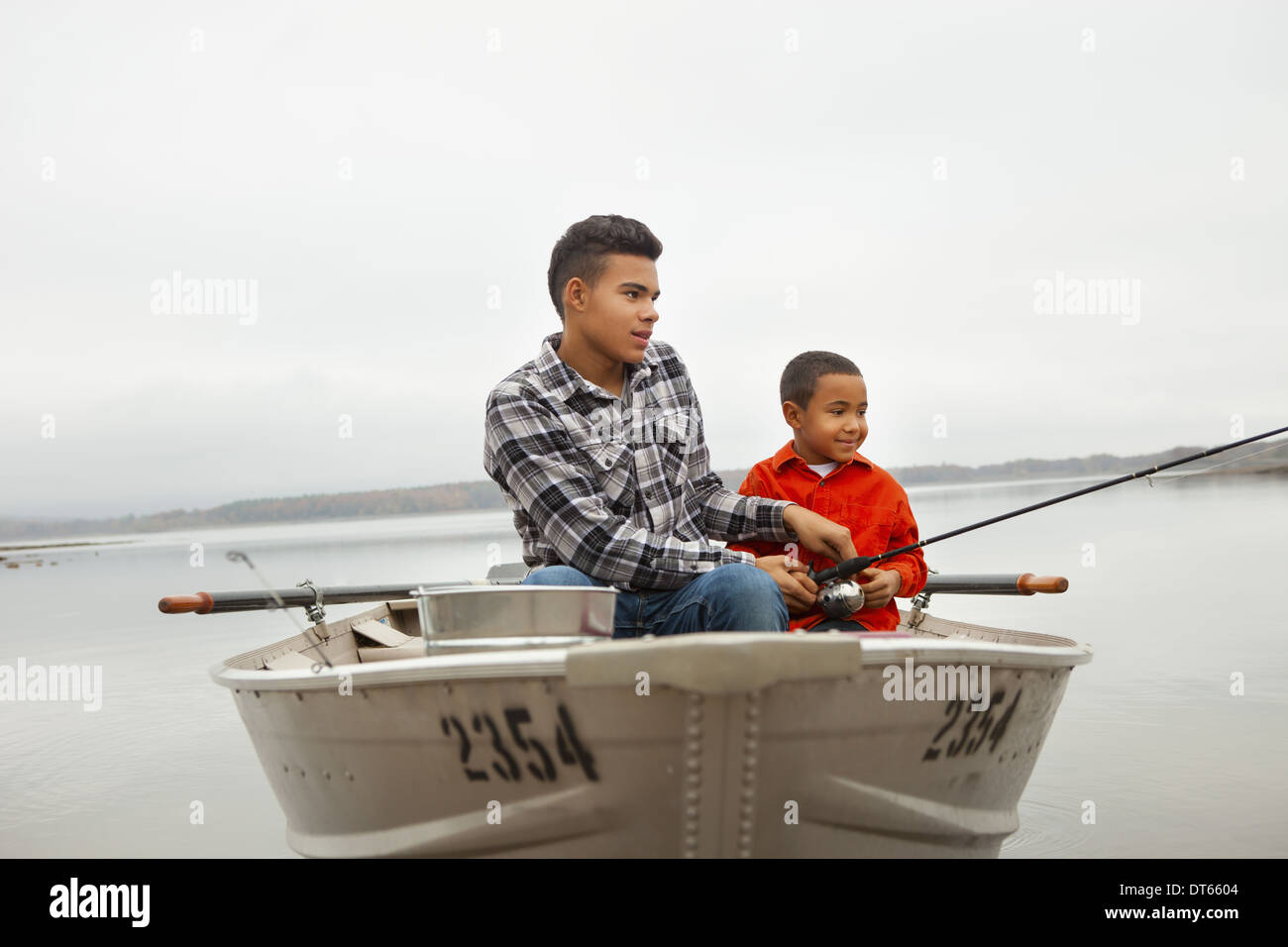 Child sitting boat hi-res stock photography and images - Alamy