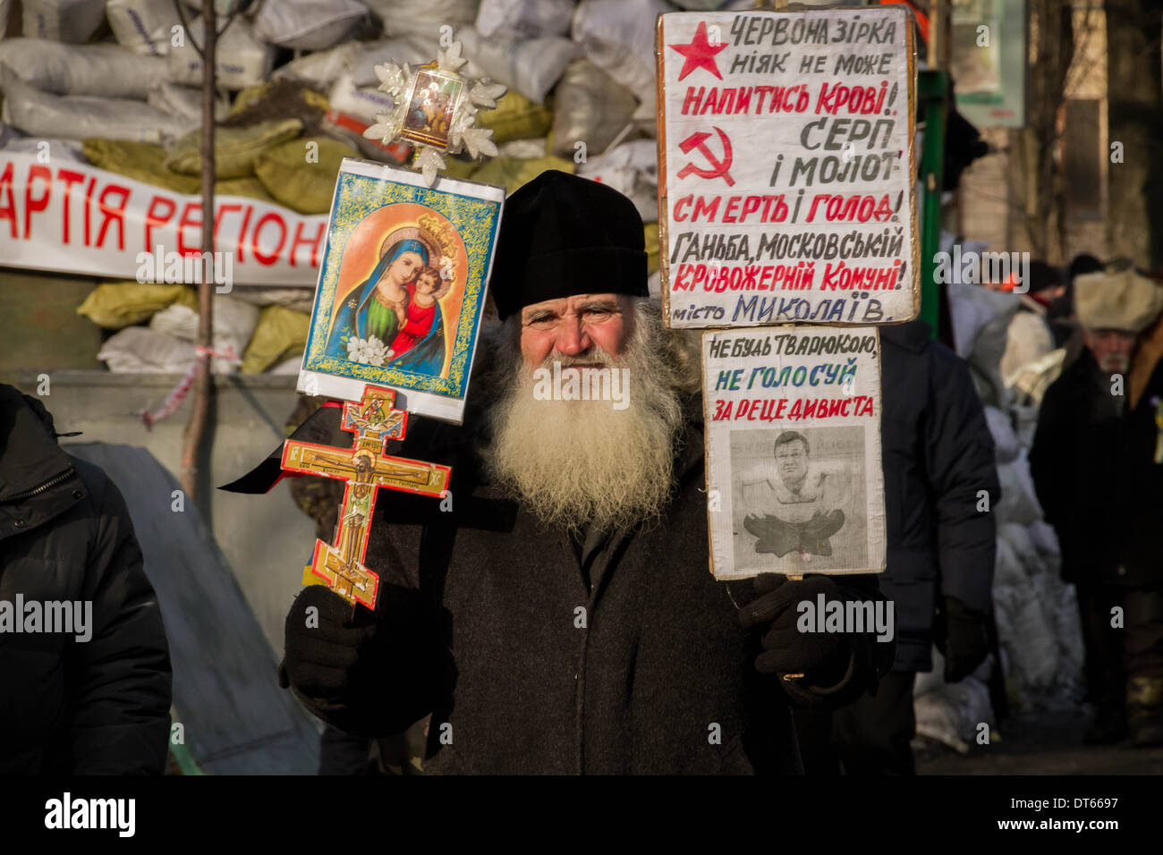 An Orthodox priest with cross and icon marches in solidarity with anti ...