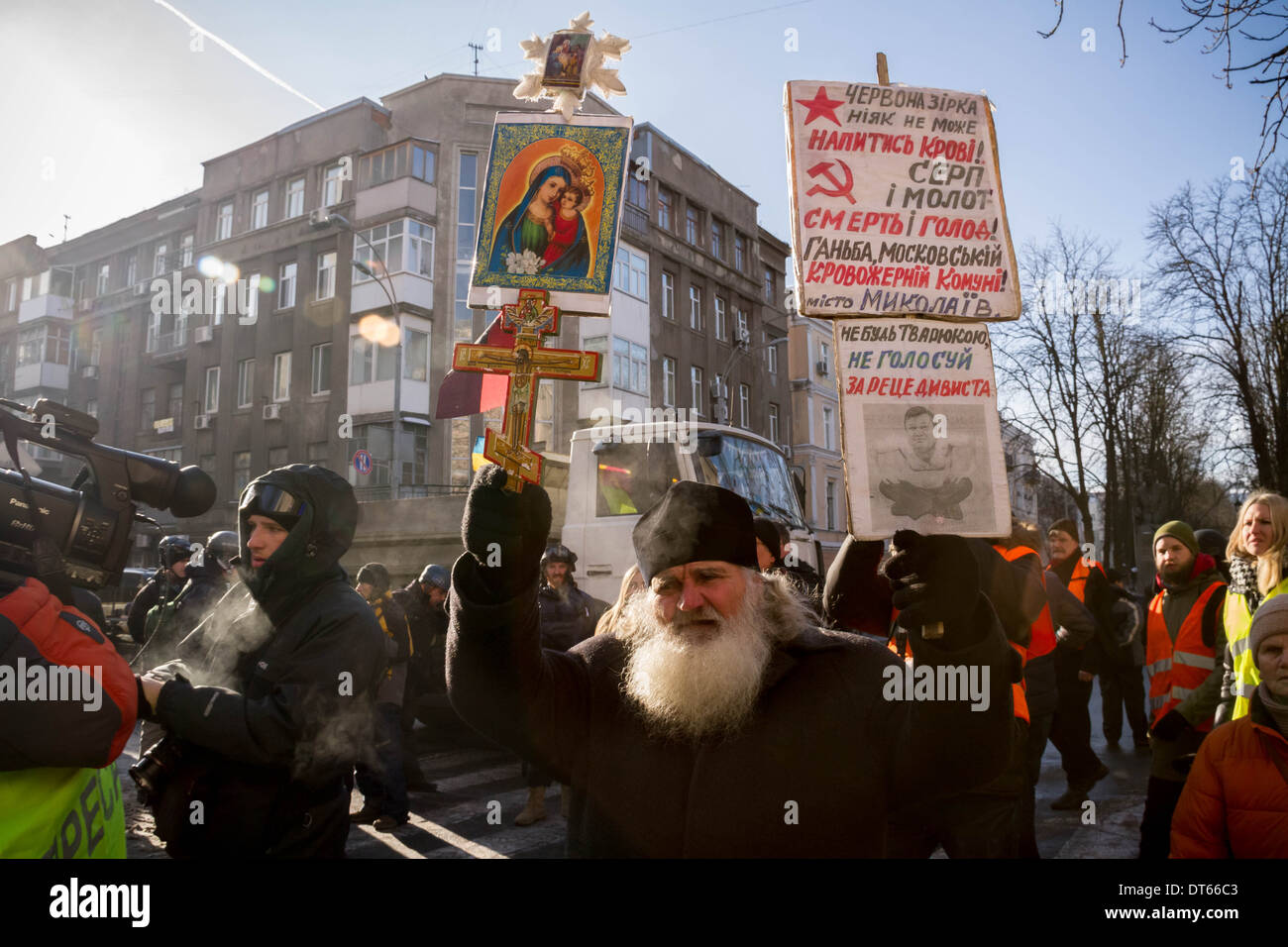 An Orthodox priest with cross and icon marches in solidarity with anti ...