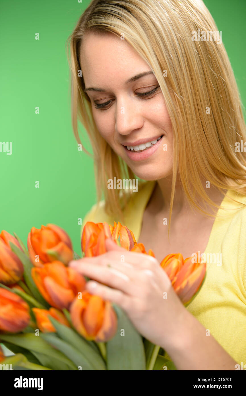 Romantic looking woman holding flowers hi-res stock photography and ...