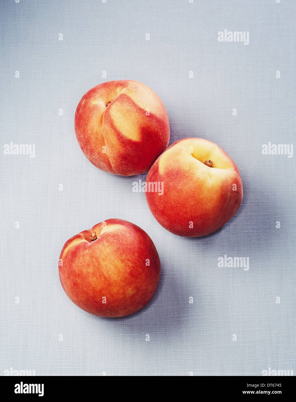 Still life of three peaches Stock Photo - Alamy